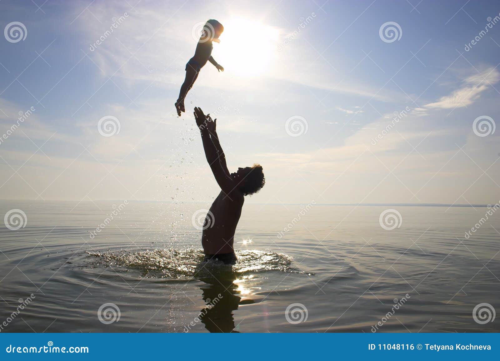 Father is Tossing Up a Child Stock Photo - Image of family, peace: 11048116