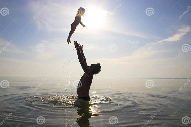 Father is Tossing Up a Child Stock Photo - Image of family, peace: 11048116