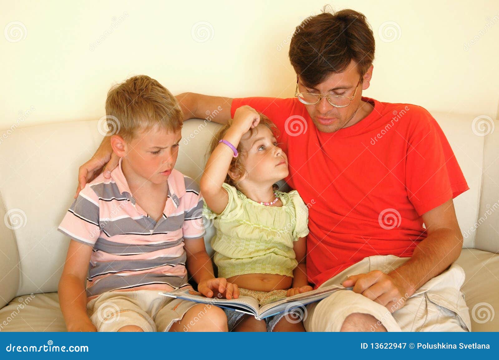 Father and Two Children Read Book Stock Image - Image of care ...