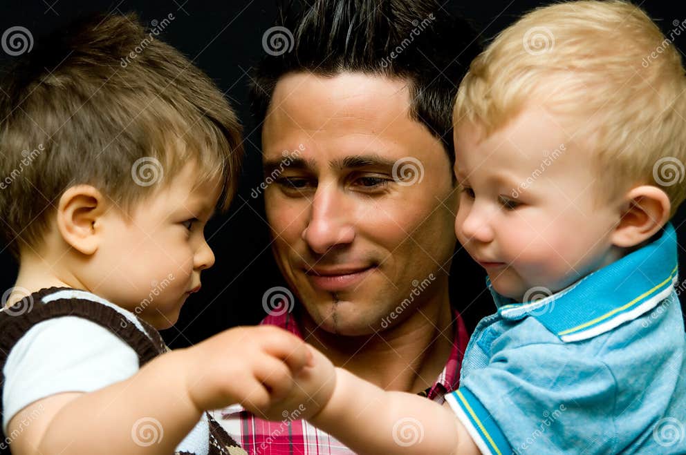 Father with two sons stock image. Image of parenthood - 15954707