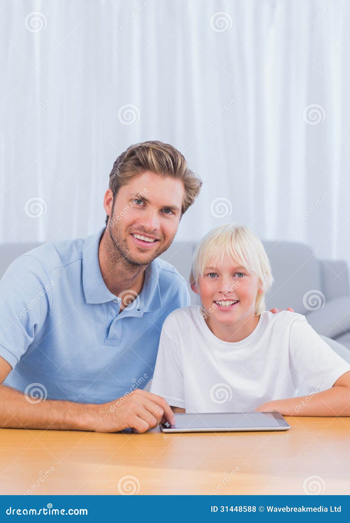 Father Using Tablet with His Son Stock Photo - Image of parent, light ...