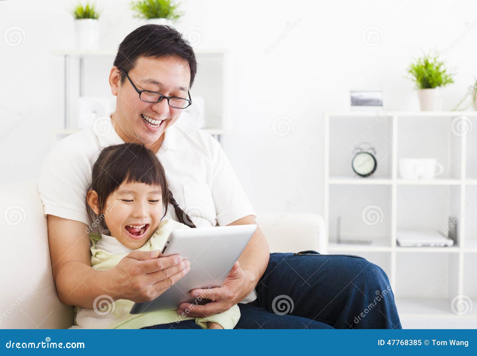 Father Using Tablet Pc with Little Girl Stock Image - Image of room ...