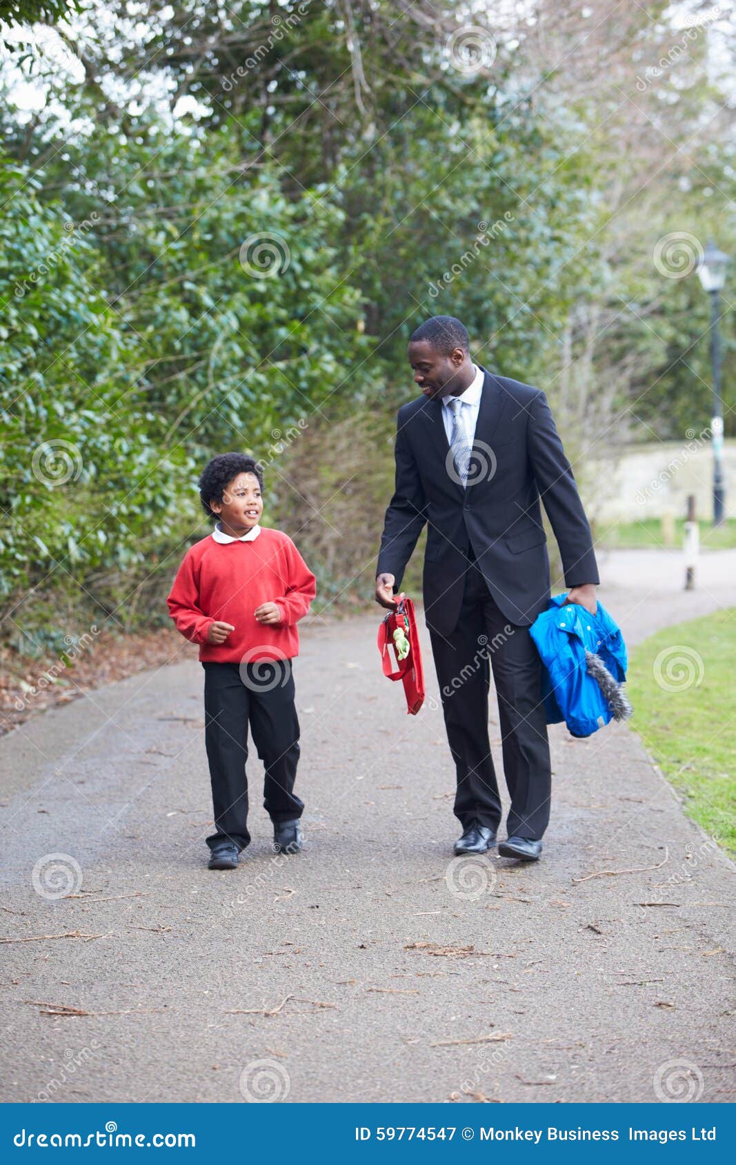 Father Walking Son To School Along Path Stock Image - Image of children ...