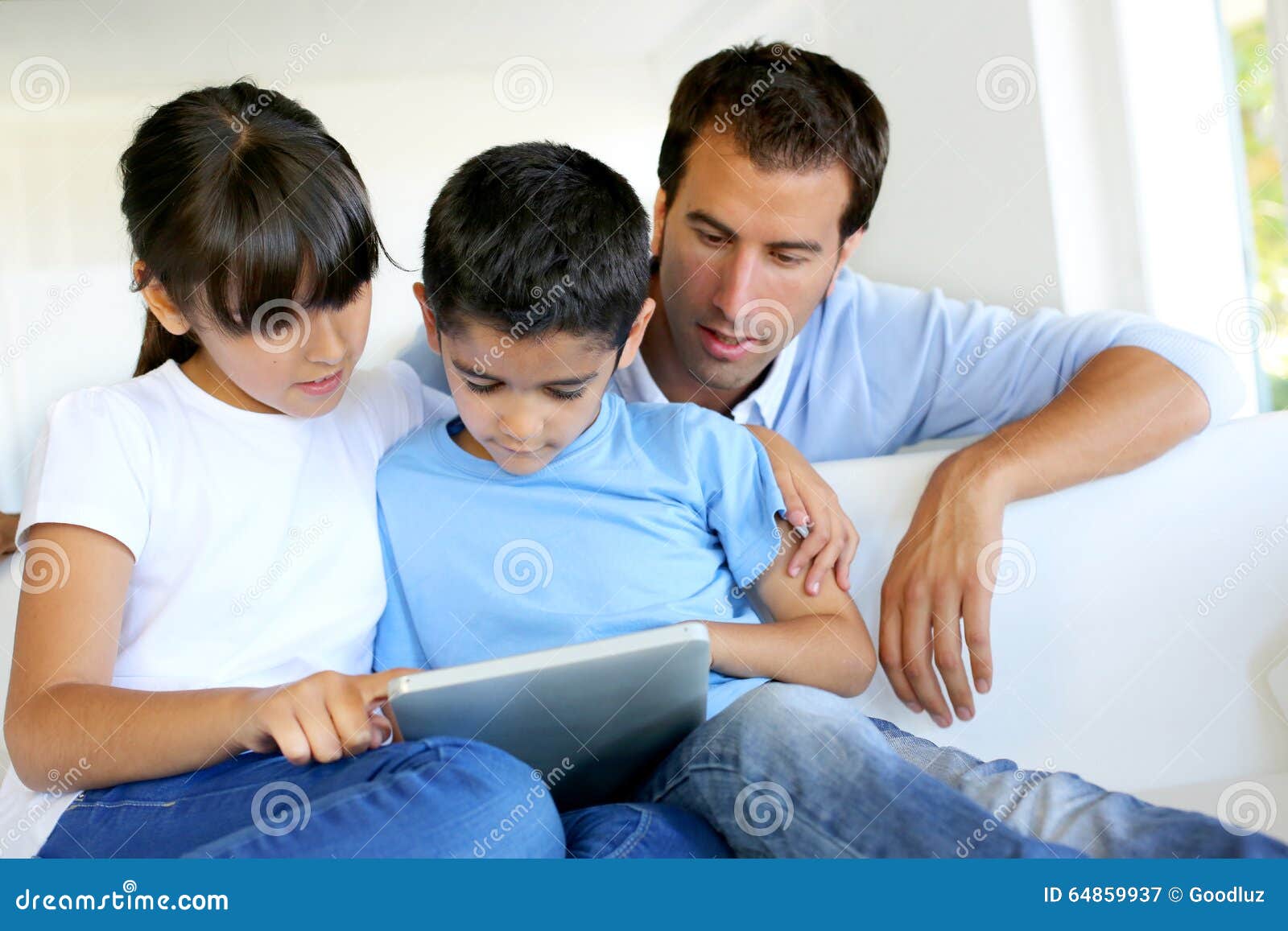 Father Watching Over Children Using Tablet Stock Image - Image of ...