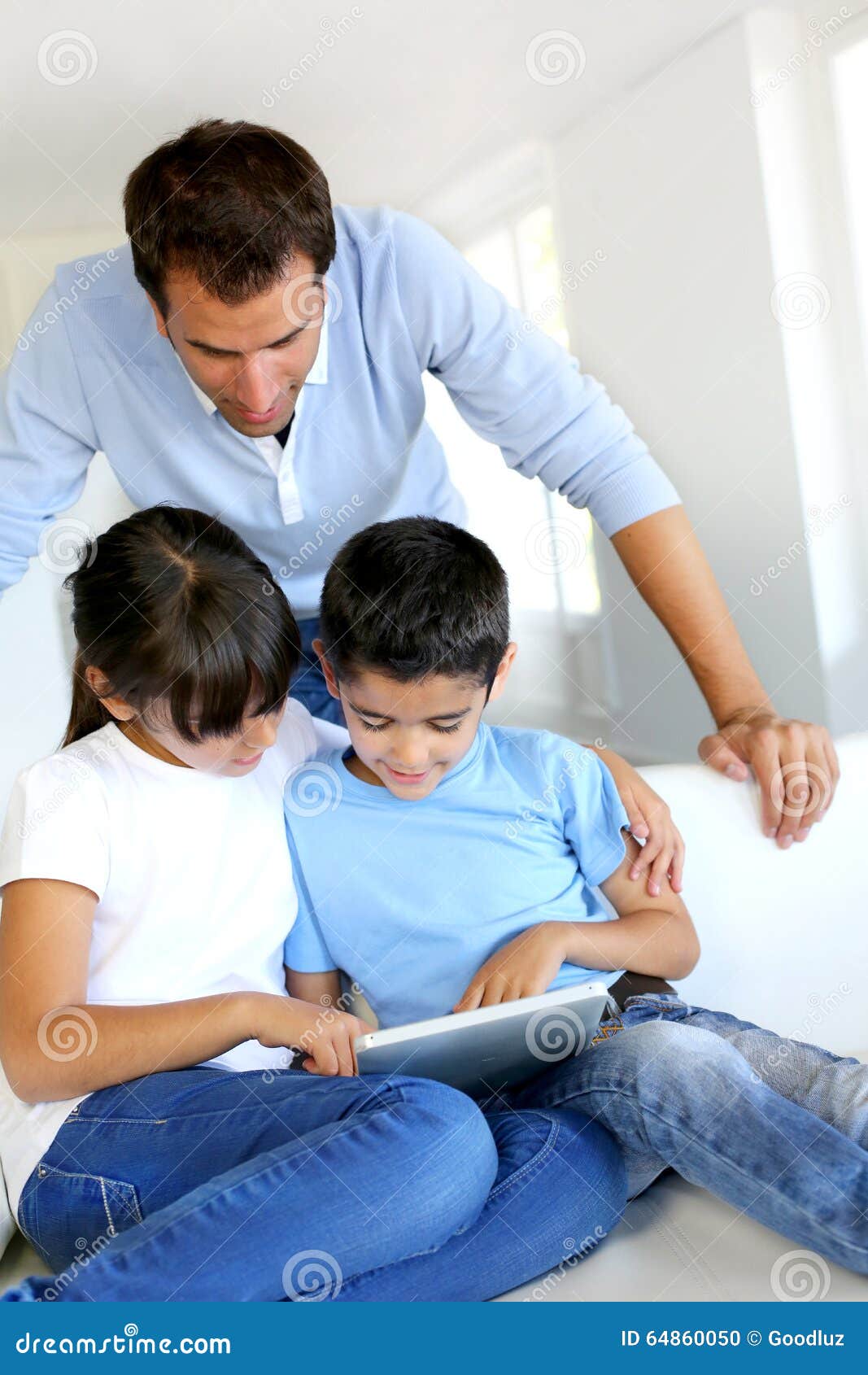 Father Watching Over Children while Using Tablet Stock Photo - Image of ...