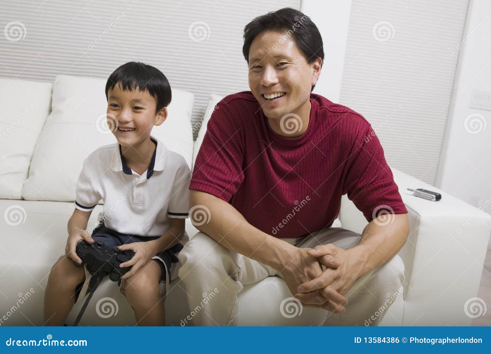 Father Watching His Two Children Walk Over Trees In A Forest Stock ...