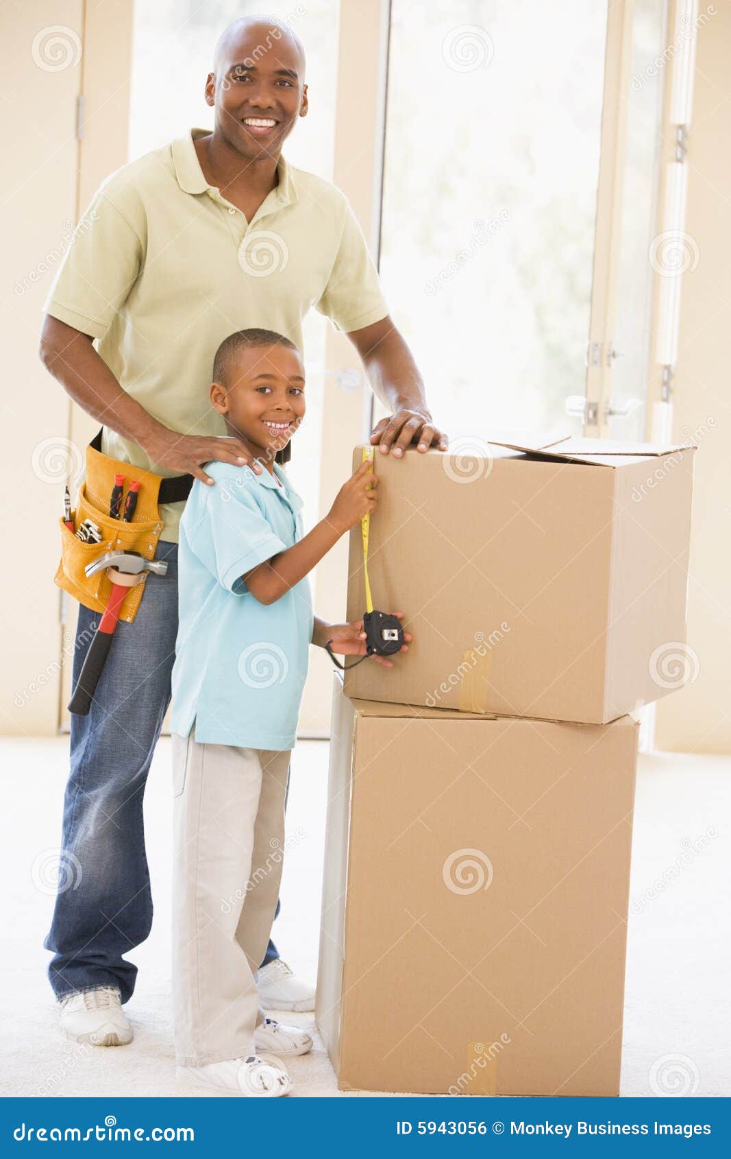 Father Wearing Tool Belt by Son in New Home Stock Photo - Image of ...