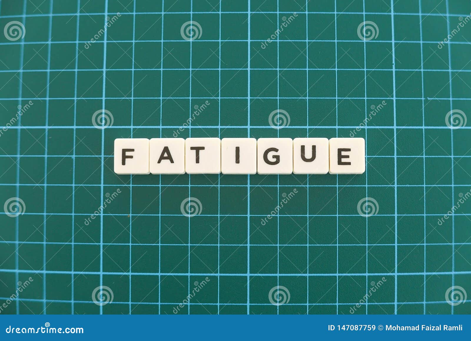 Fatigue Word Made of Square Letter Word on Green Square Mat Background ...