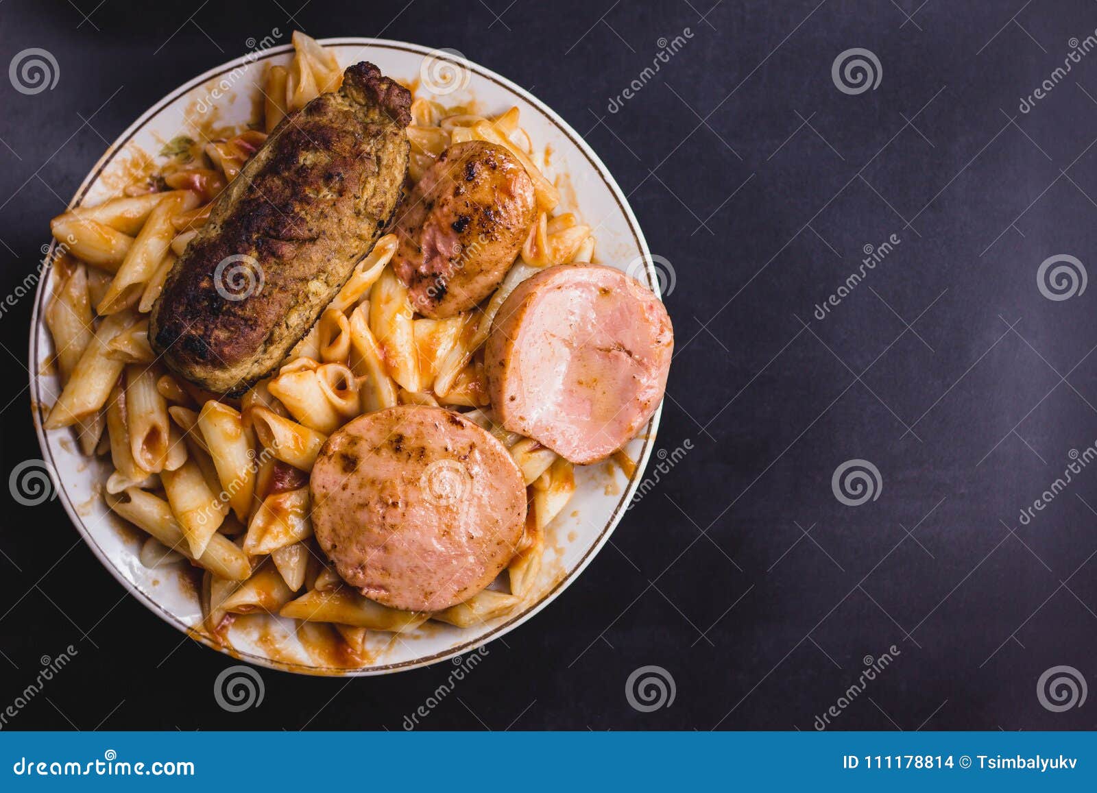 Fatty Food in a Plate on a Black Background Stock Photo - Image of ...