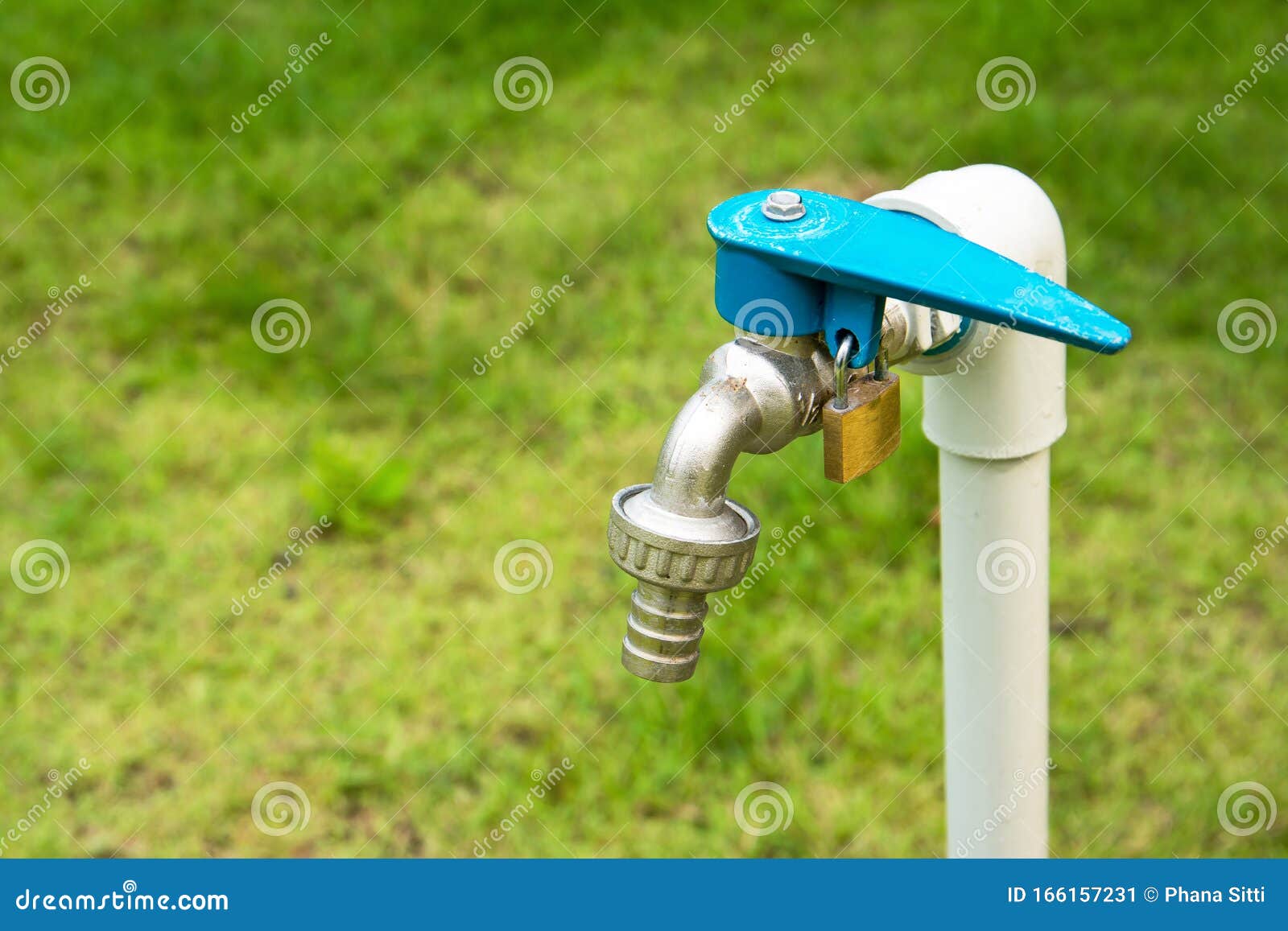Faucet with Key Lock with Grass Field Background Stock Image - Image of ...