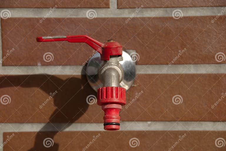 Faucet with red tap stock image. Image of flowing, garden - 5364171