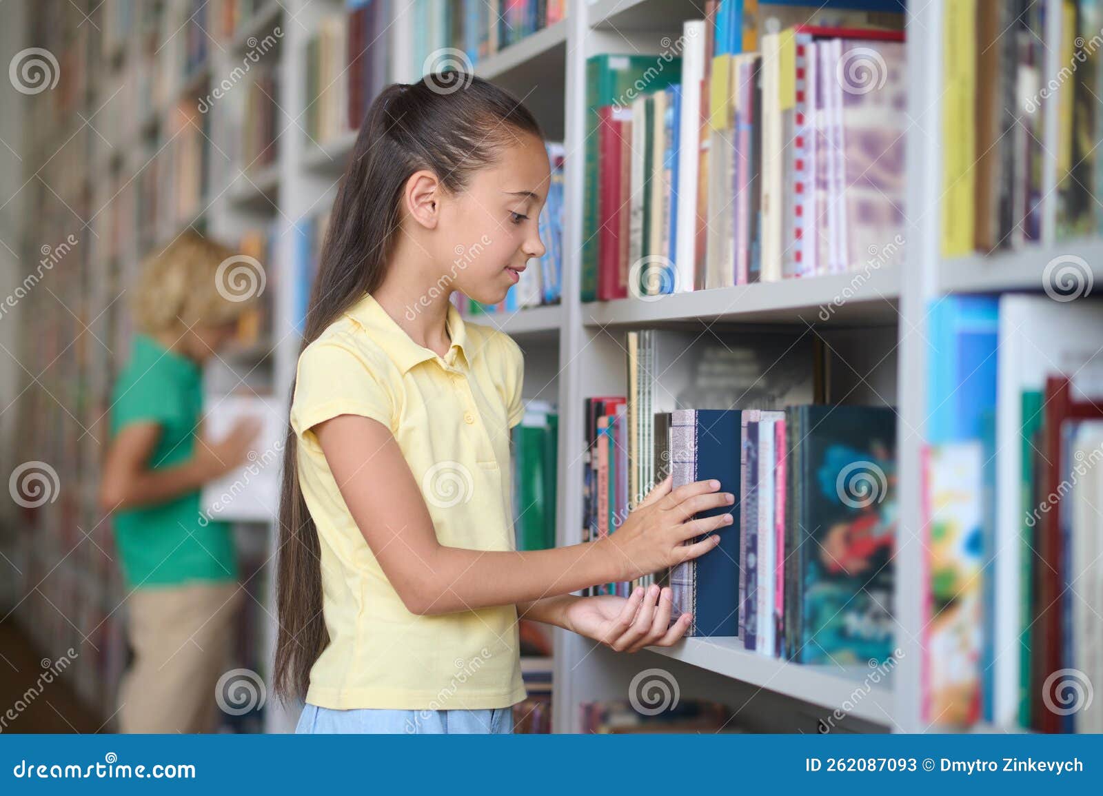 Girl Taking a Book from the Shelf in the Library Stock Image - Image of ...