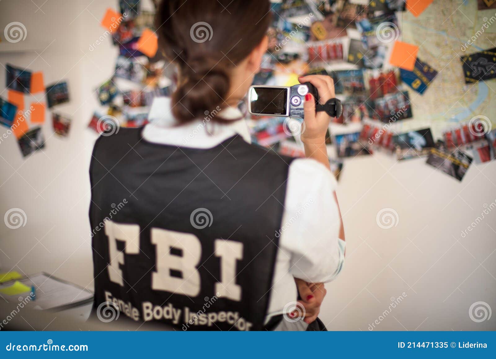 FBI Female Agent Using Camera Stock Image - Image of dtective, clues ...