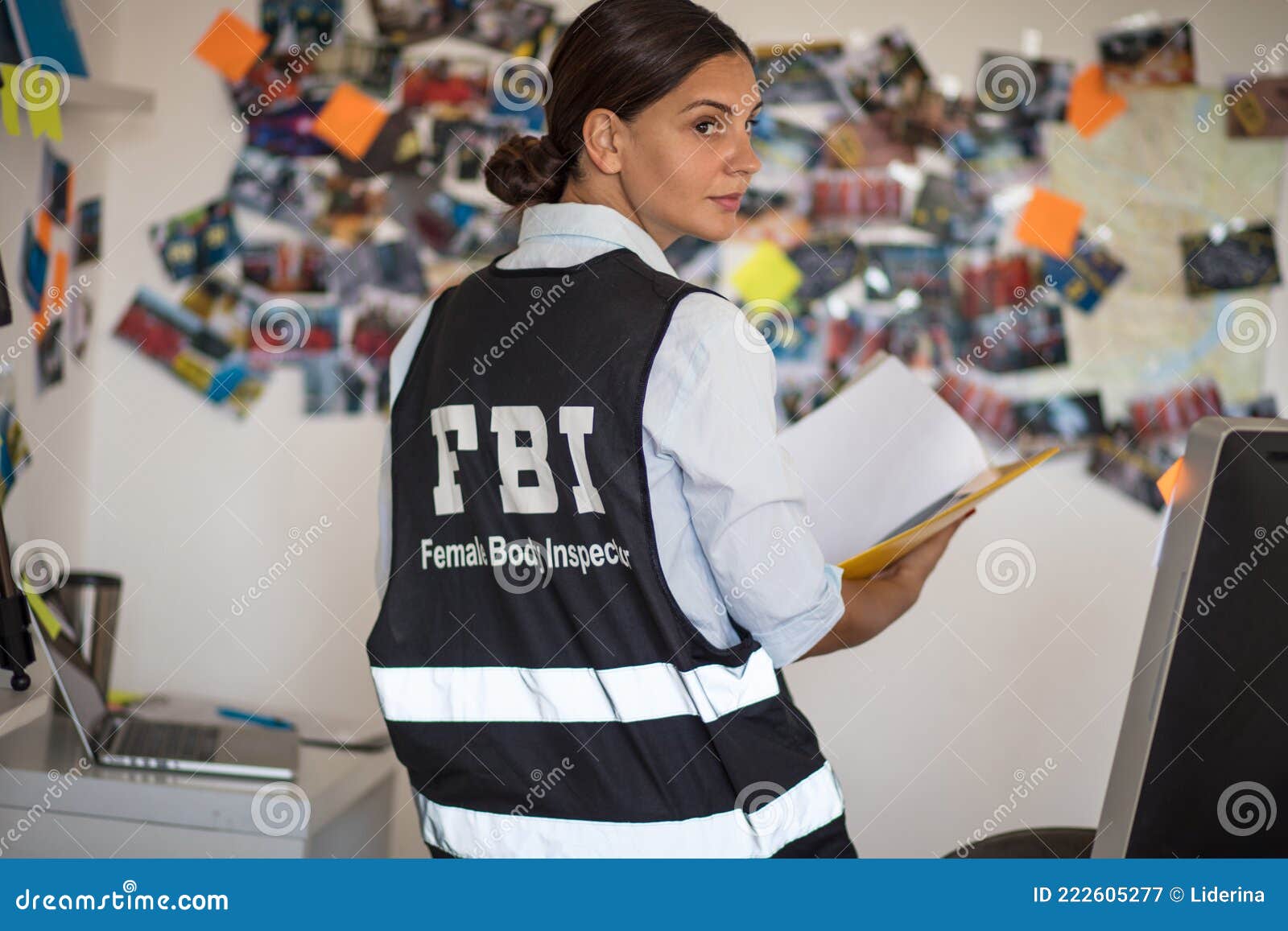 FBI Woman Works on a Case. Holding Document Stock Image - Image of ...