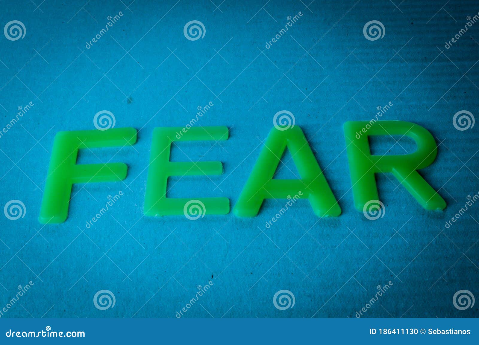 Fear. Word Made by Green Letters on Blue Background Stock Photo - Image ...