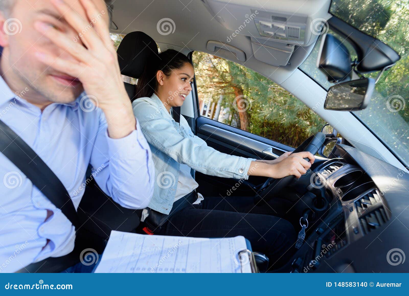 Fearful Driving Instructor with Female Learner Driver Stock Photo ...