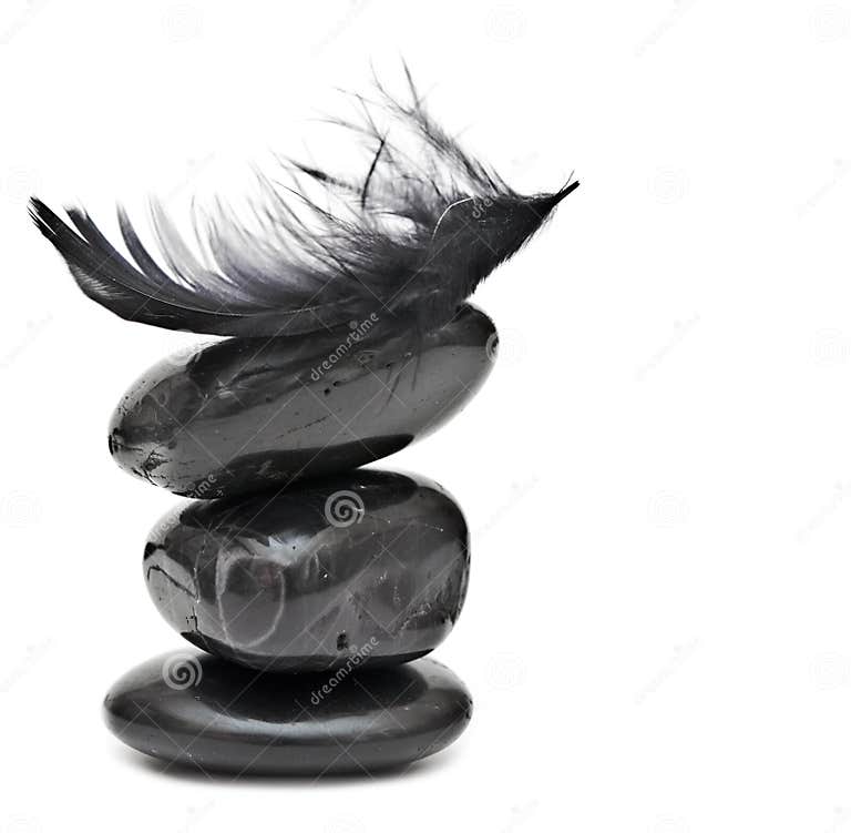 Feather Balancing on Stack of Black Stones Stock Photo - Image of ...