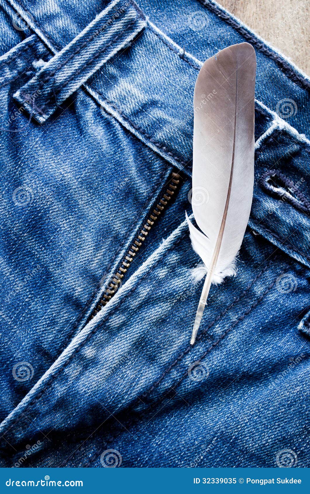 Feather on jeans stock image. Image of wear, pattern - 32339035