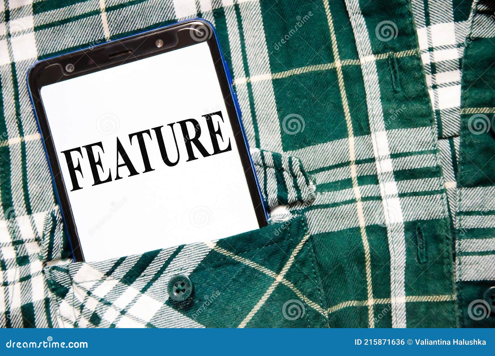 Feature the Word is Written on the White Screen of the Phone that Lies ...