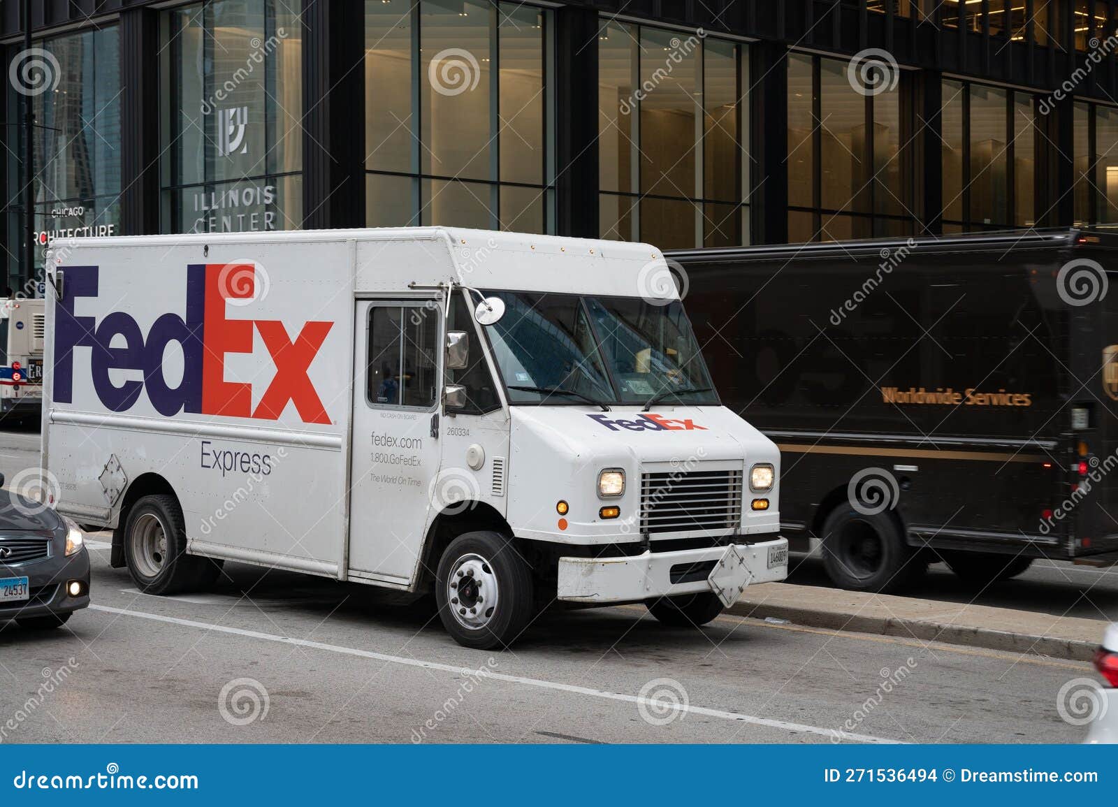 FedEx Delivery Driving in a Busy Street Editorial Stock Image - Image ...
