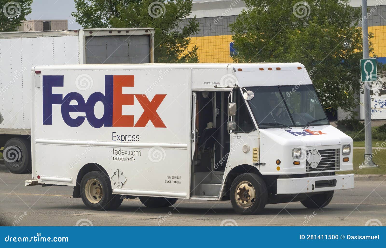 A Fedex Delivery Service Truck Van on the Route during Spring Editorial ...