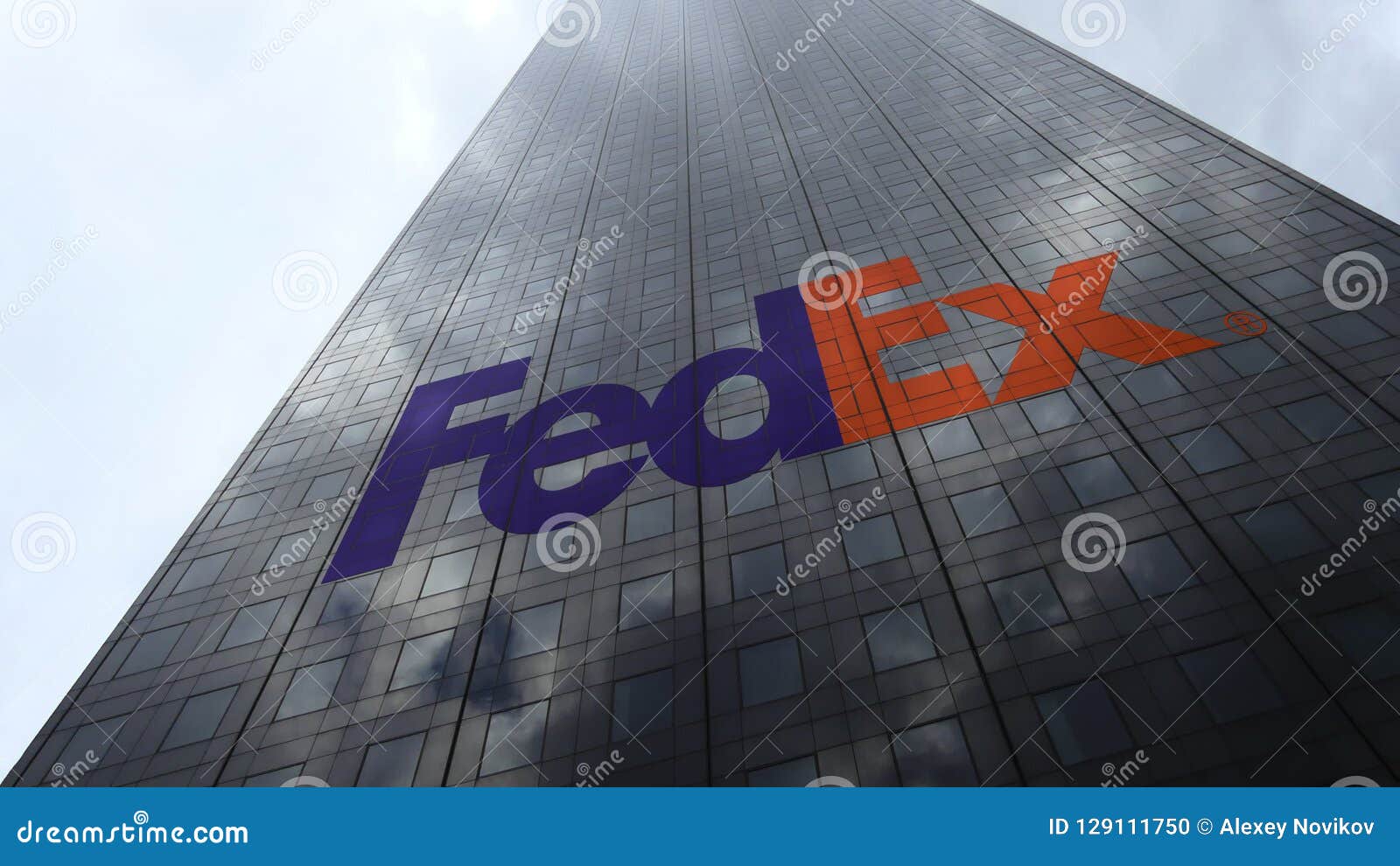 FedEx Logo on a Skyscraper Facade Reflecting Clouds, Time Lapse ...