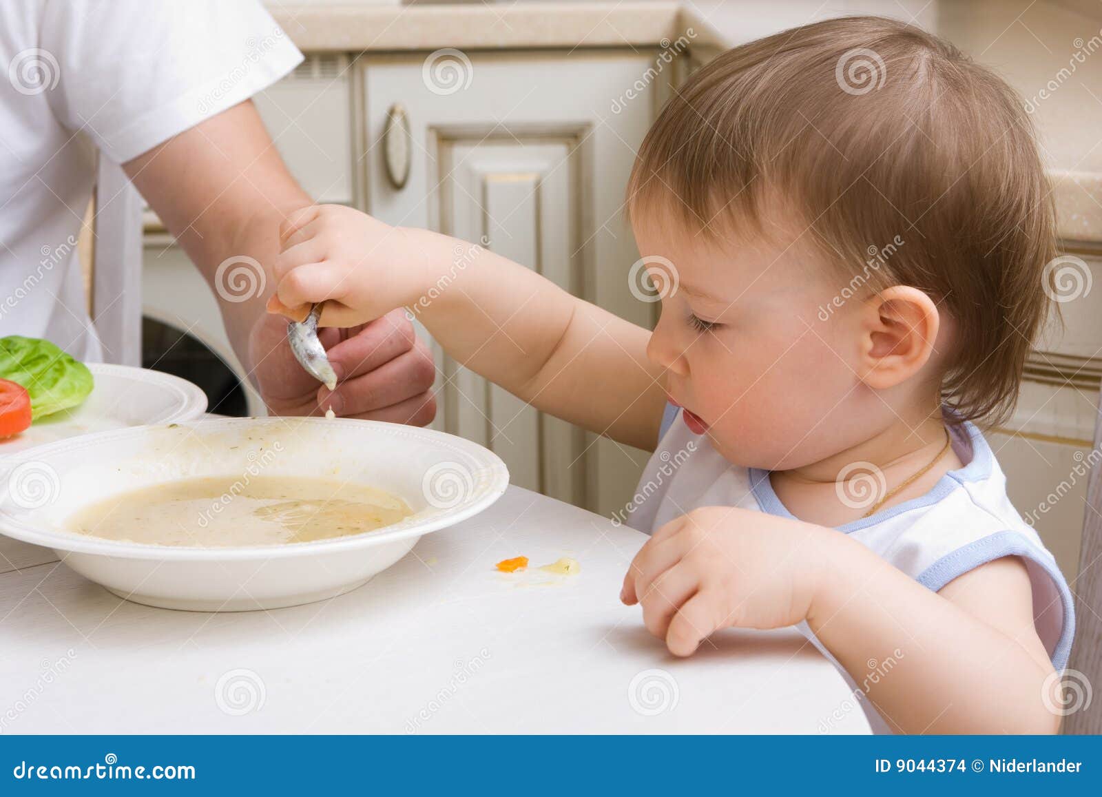 Feeding child stock photo. Image of kitchen, cute, table - 9044374