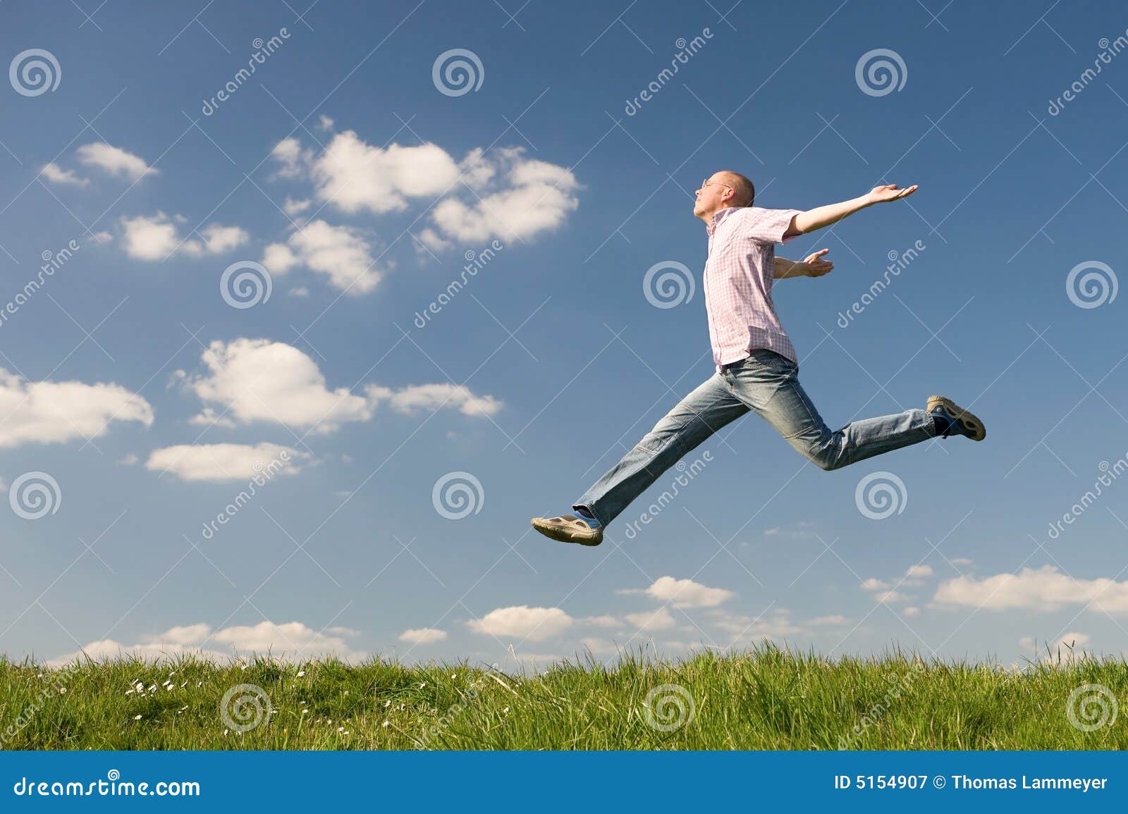 Feel free stock image. Image of field, jump, clouds, sport - 5154907
