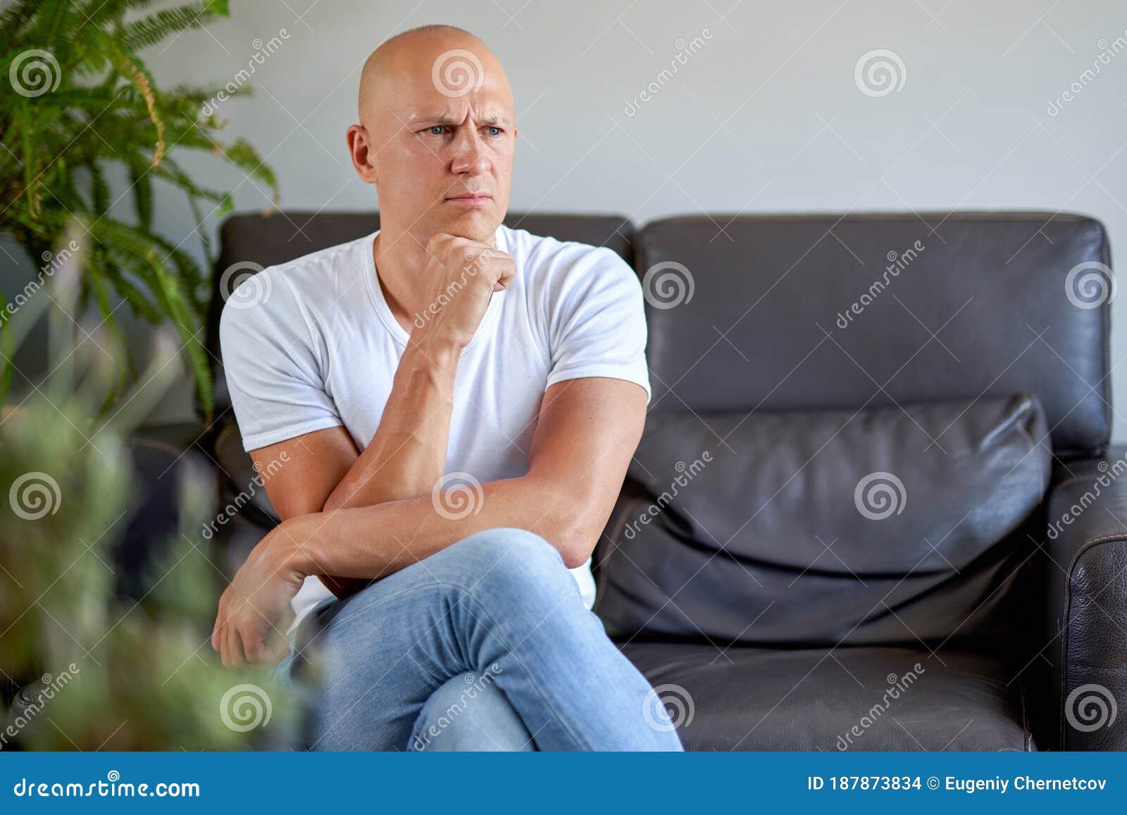 Feeling Depressed. Desperate Man Sitting on the Couch at Home Stock ...