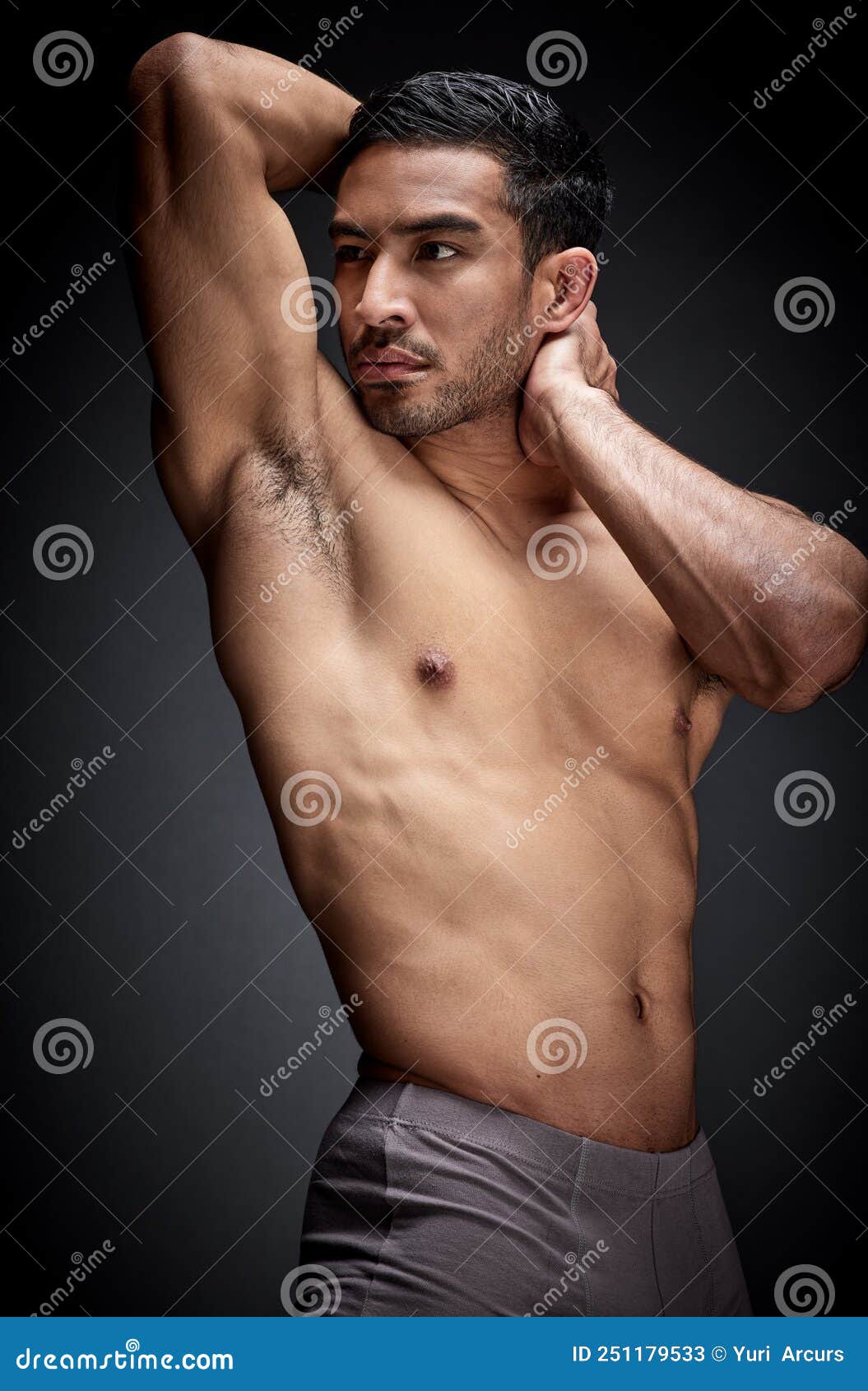 Feeling Fit and Sexy. a Handsome Young Man Standing Alone and Posing ...