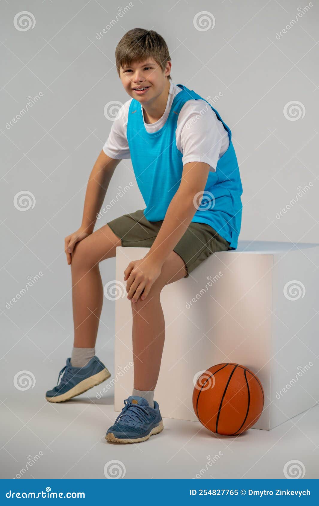 A Contented Boy Sitting on a Cube and Smiling Stock Image - Image of ...