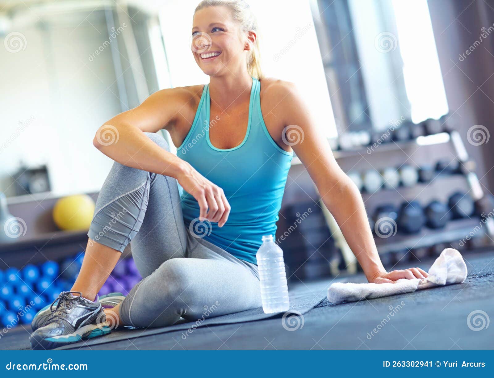 Feeling Happy after My Workout. a Smiling Blonde at the Gym Sitting on ...