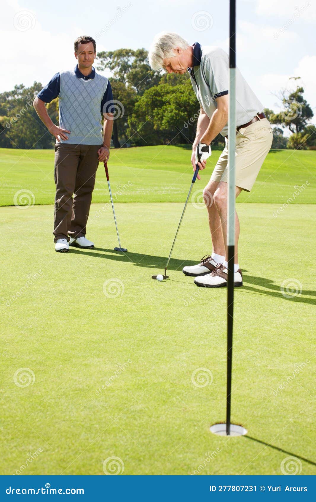 Feeling the Pressure of that Final Hole. Two Men Out on the Green ...