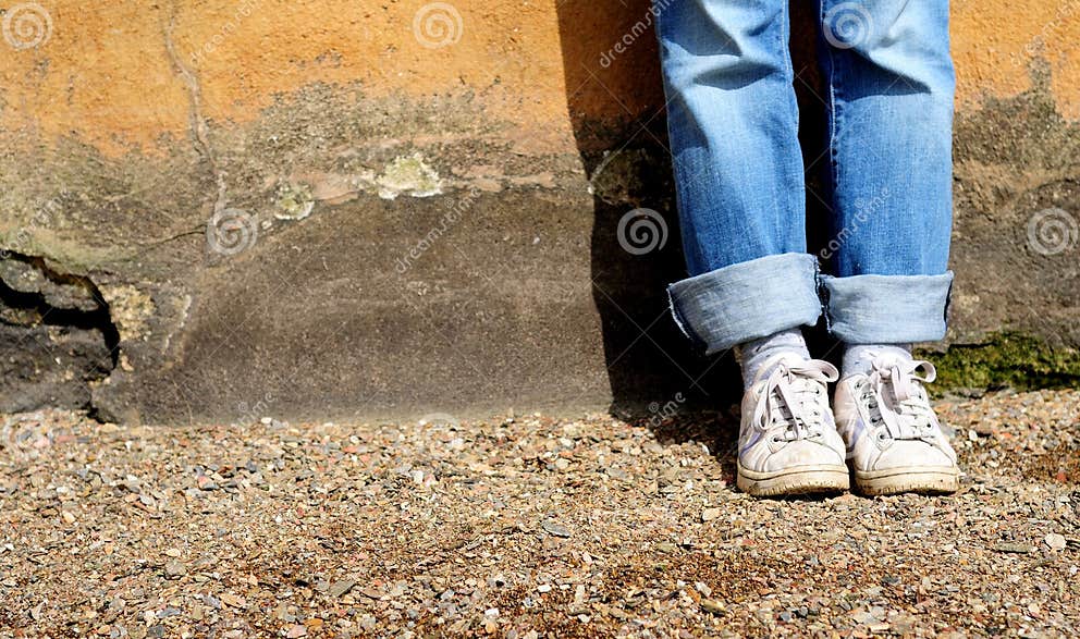 Feet against the wall stock photo. Image of tied, wall - 12843808
