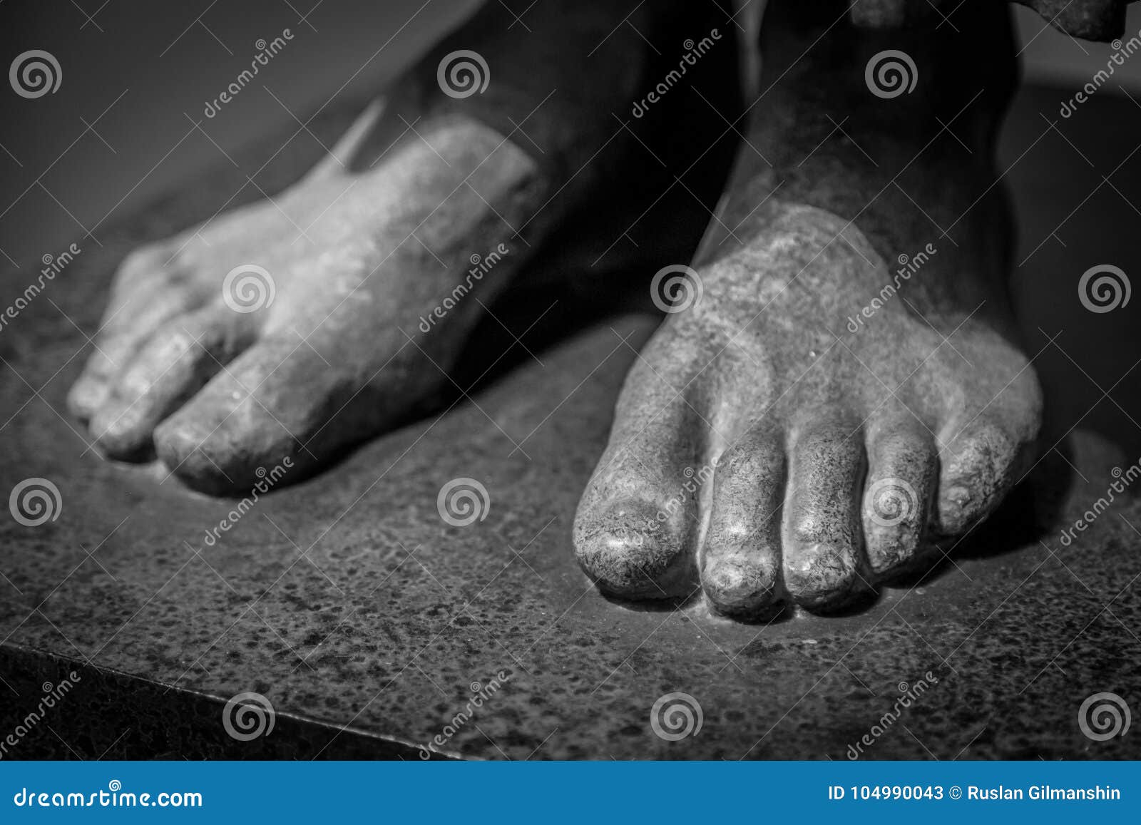 Feet of an ancient statue stock image. Image of close - 104990043