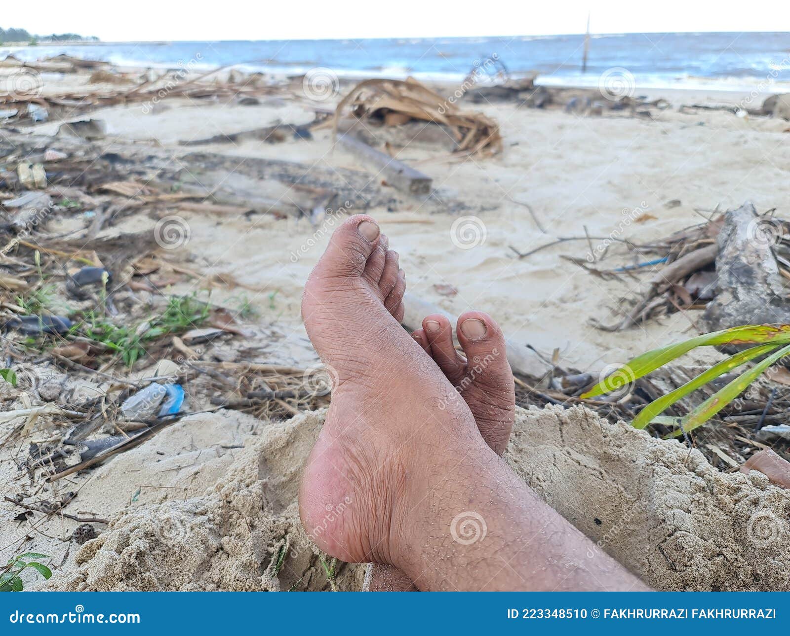 Of Feet on the Beach Full of Trash Stock Photo - Image of wood, person ...