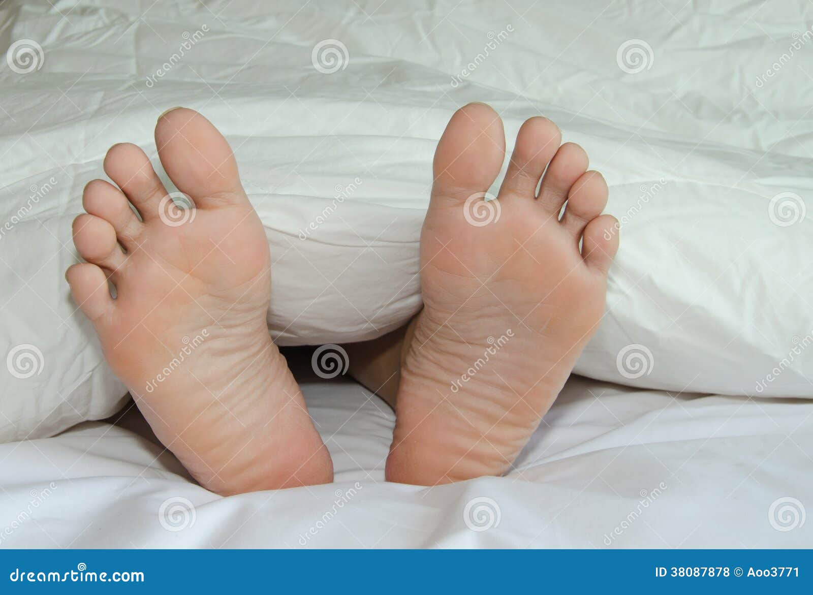 Feet are on the bed stock photo. Image of bare, lying - 38087878