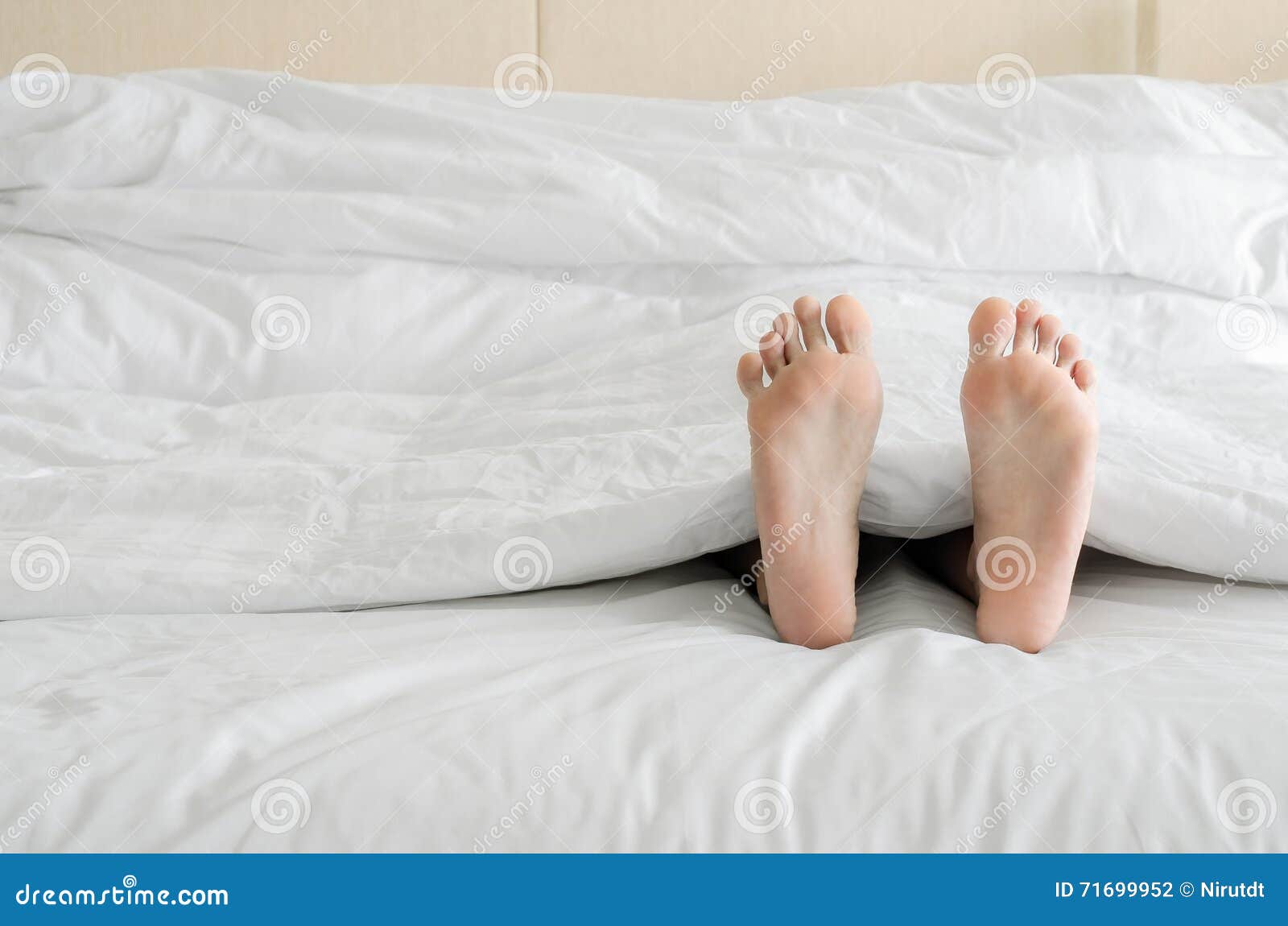 Feet in Bed stock photo. Image of morning, sleepy, sleeping - 71699952