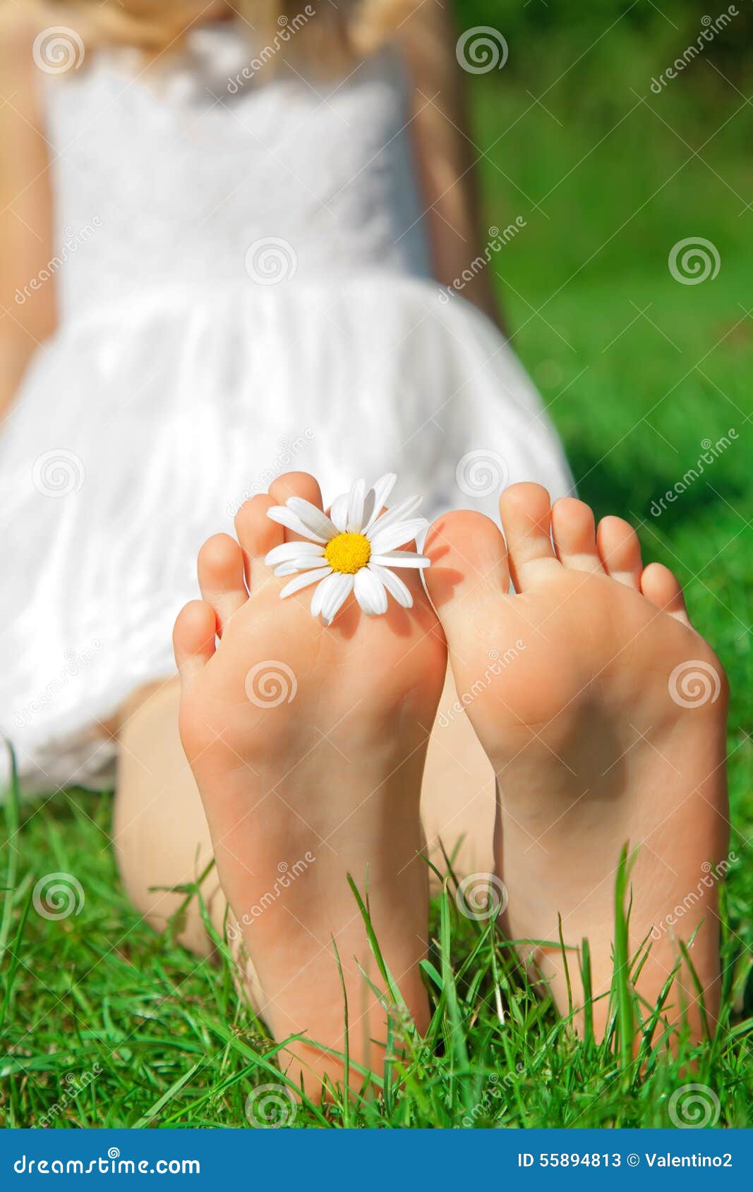 Feet of a Child with Flower Stock Image - Image of flower, grass: 55894813