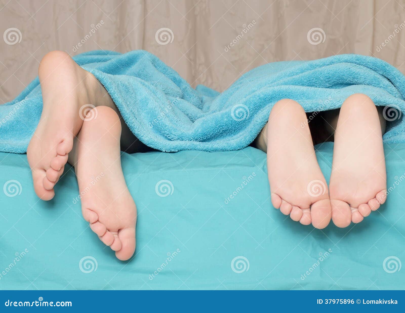 Feet of Children Lying on the Bed Stock Photo - Image of bonding ...