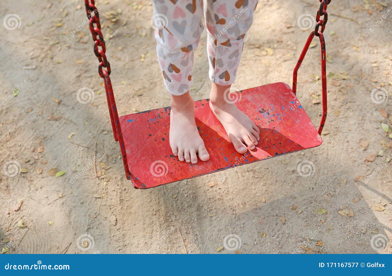 Feet of Children Standing on Red Swing Stock Image - Image of playful ...