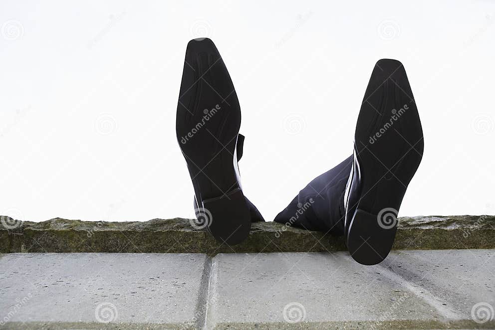 Feet Dangling Over Wall stock photo. Image of person - 29657870