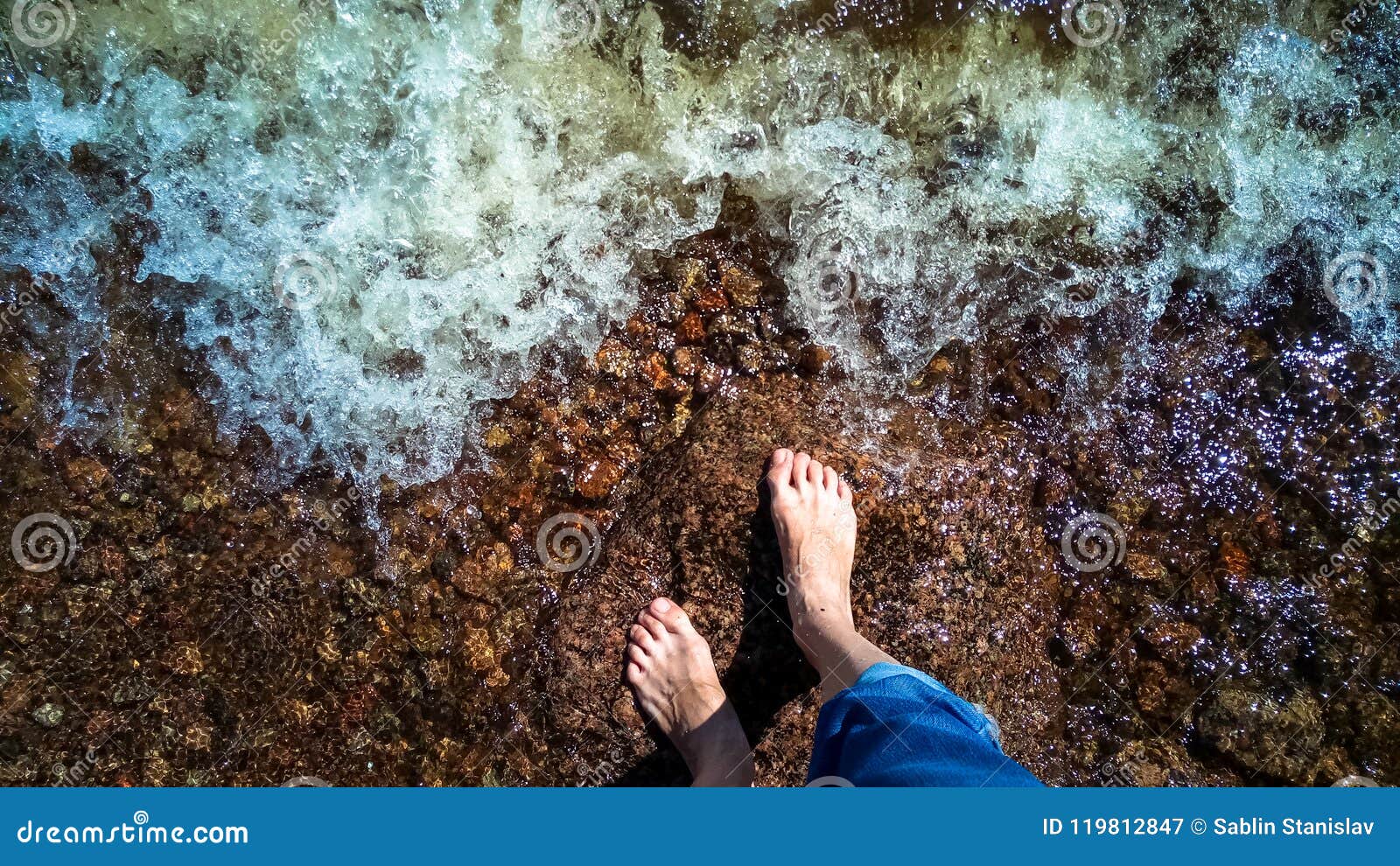 Feet in the Dark Water of an Approaching Wave. Stock Image - Image of ...