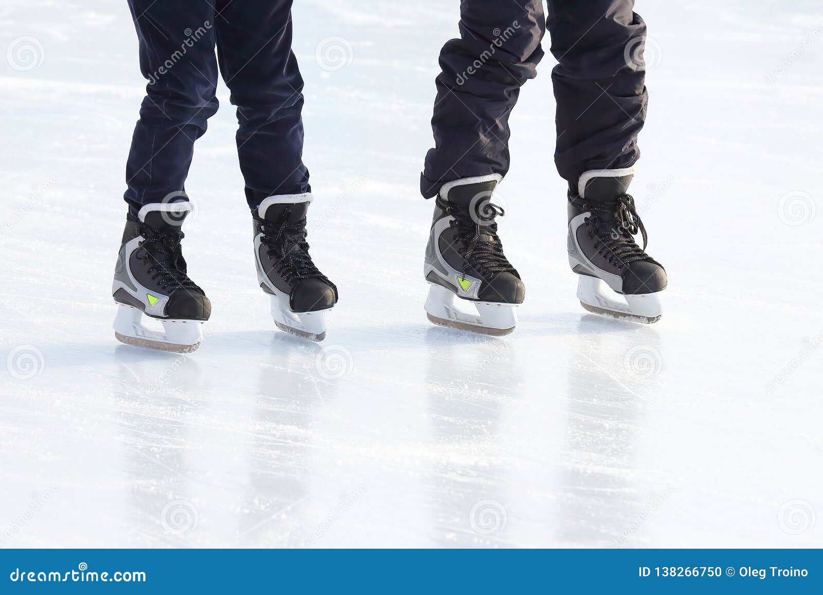 Feet of Different People Skating on the Ice Rink Stock Photo - Image of ...