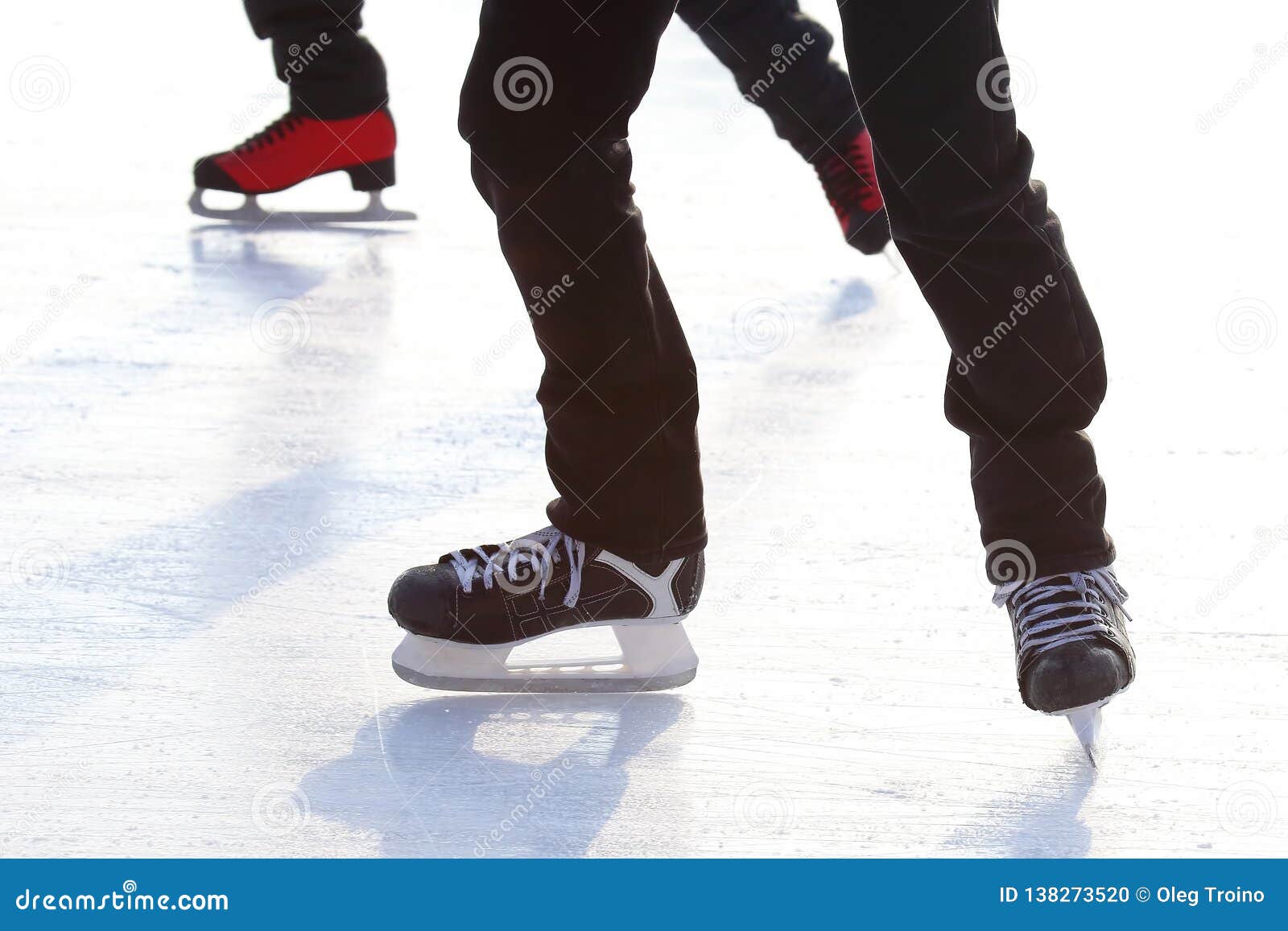 Feet of Different People Skating on the Ice Rink Stock Photo - Image of ...