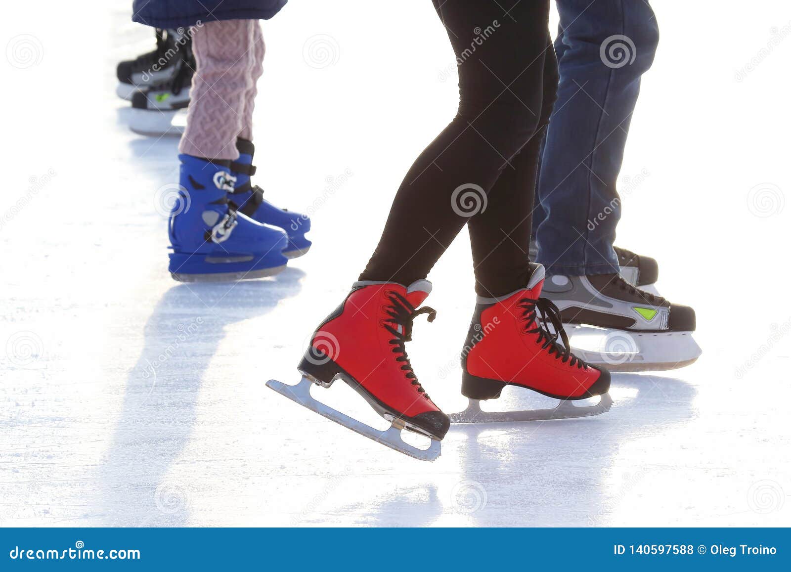 Feet of Different People Skating on the Ice Rink Stock Photo - Image of ...