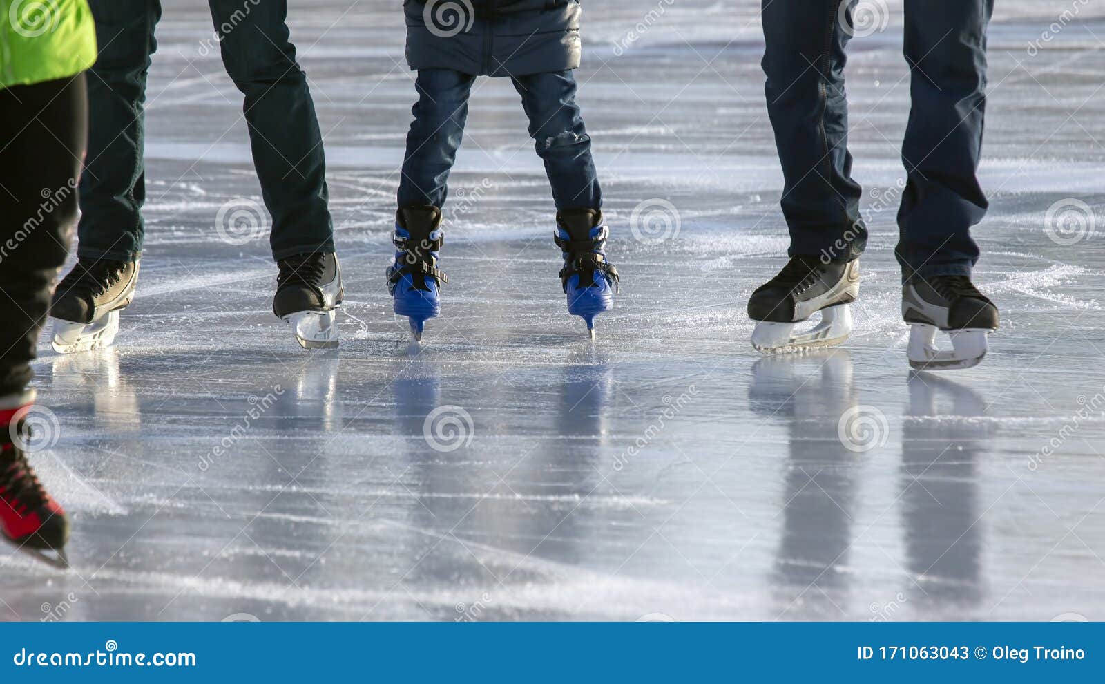 Feet of Different People Skating on the Ice Rink Stock Image - Image of ...