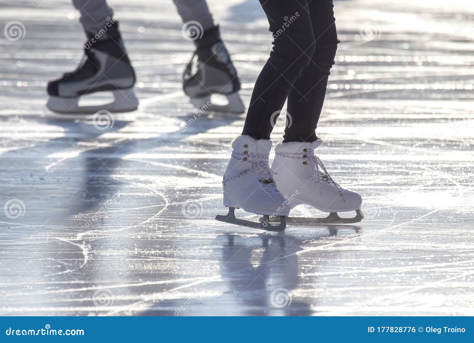 Feet of Different People Skating on the Ice Rink Stock Photo - Image of ...