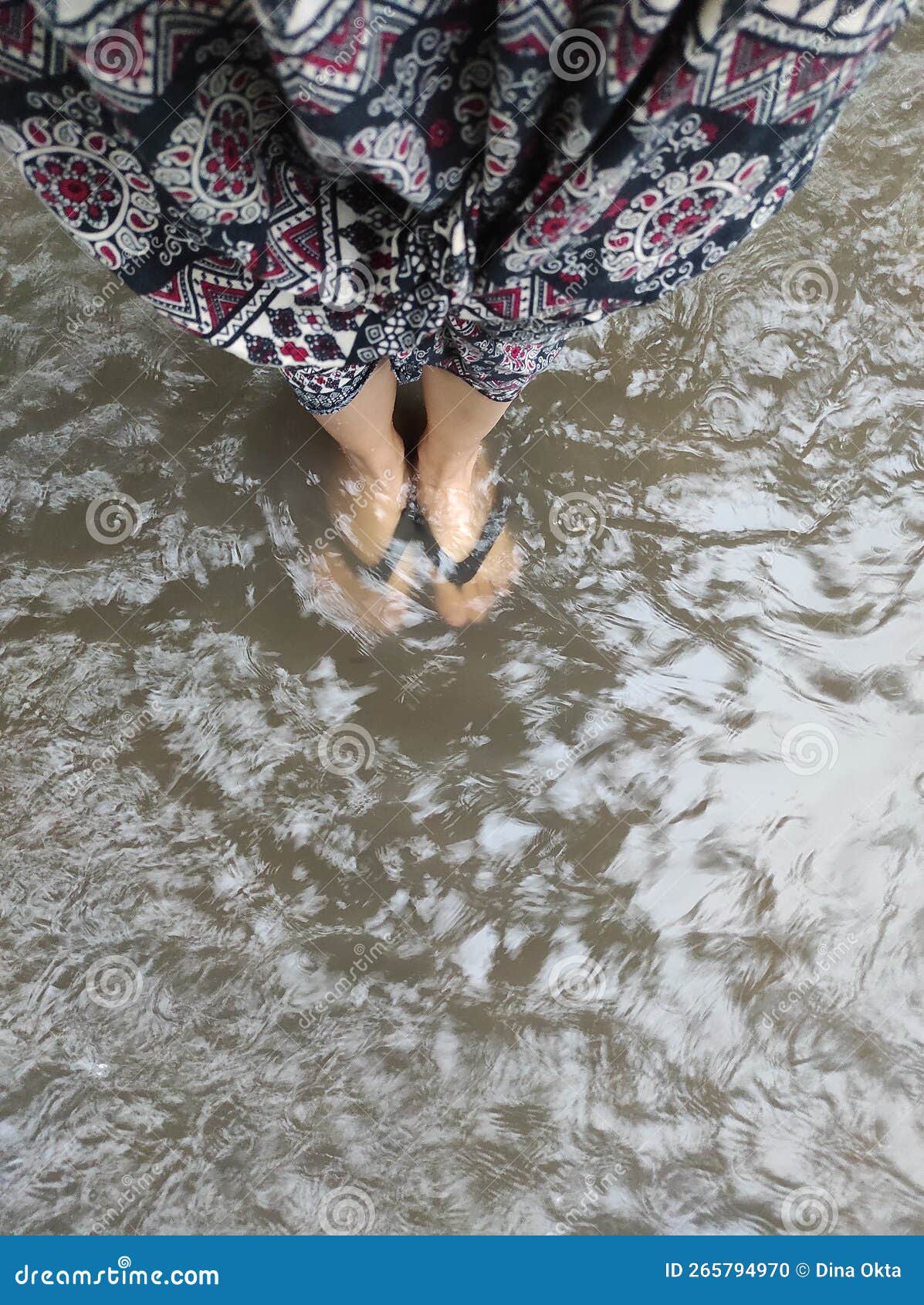 Feet in a flood water stock photo. Image of spring, blue - 265794970
