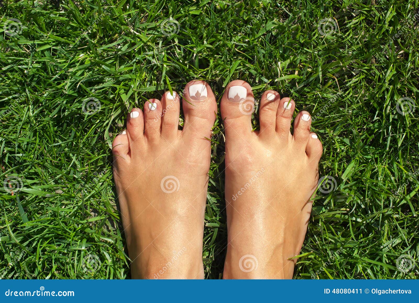 Feet on the grass stock image. Image of female, nails - 48080411